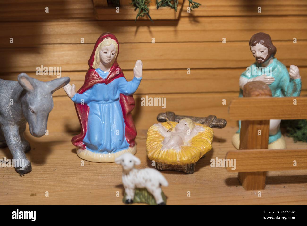 Detail of an atmospheric nativity scene scene with painted figures ...