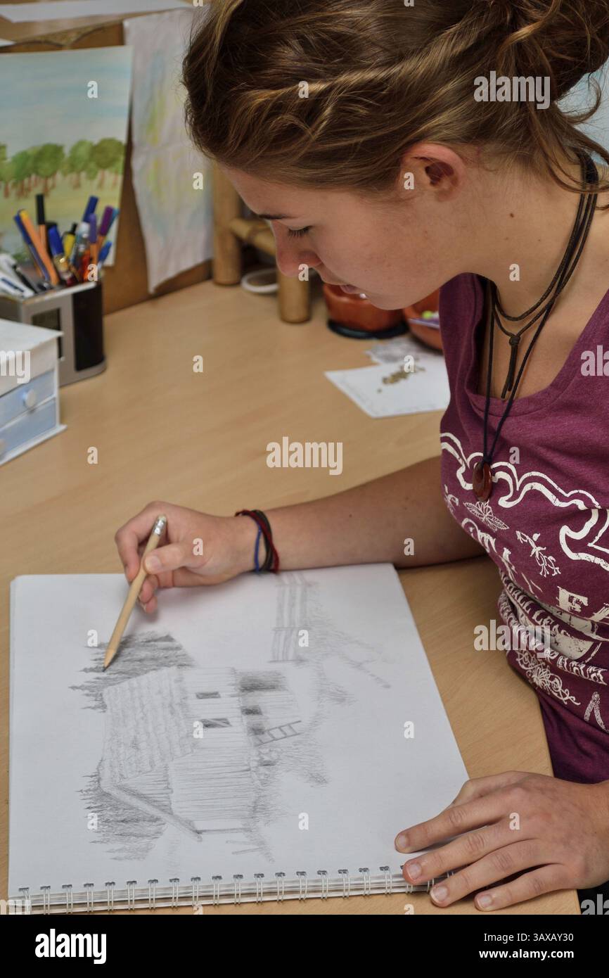 Talented teenager doing a pencil drawing Stock Photo - Alamy