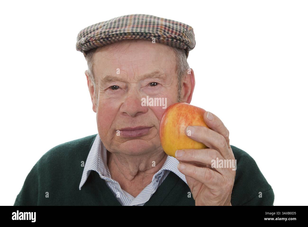 Old man holding an apple - optional Stock Photo - Alamy