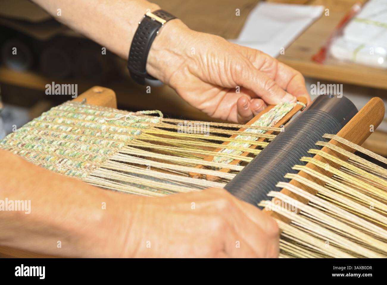 Weaving techniques with a special table loom - close-up of the weaving ...