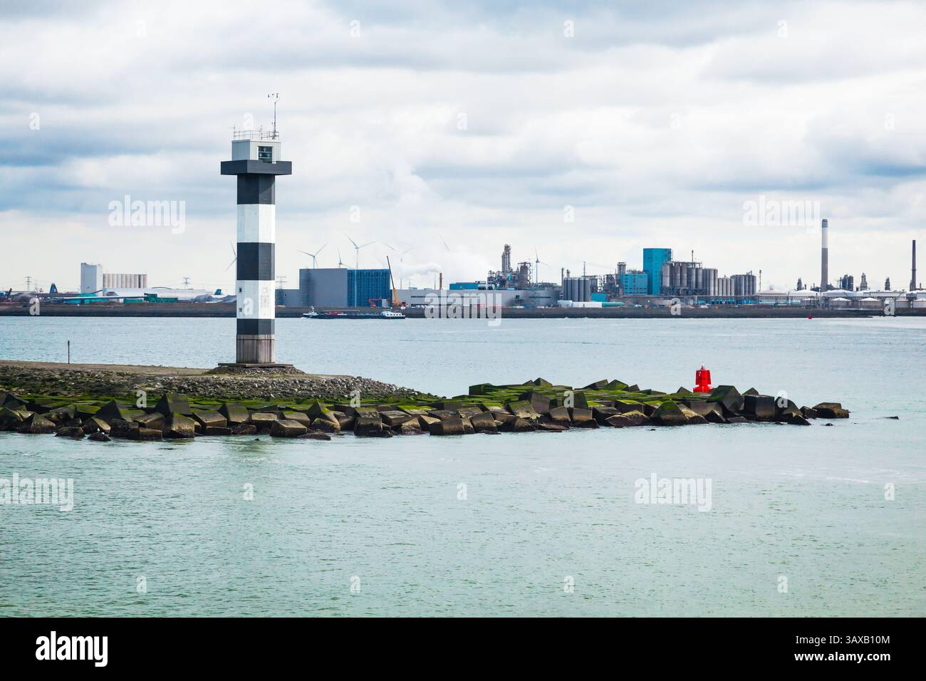 A river lighthouse in the middle of a water channel near the port of ...