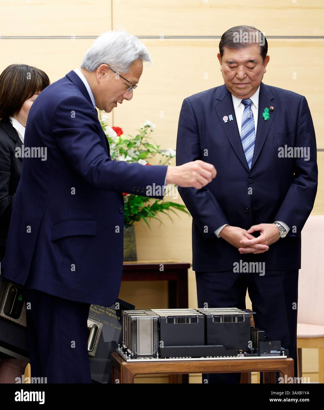 Nvidia CEO Jensen Huang, left, explains the GPU technology to Japanese ...