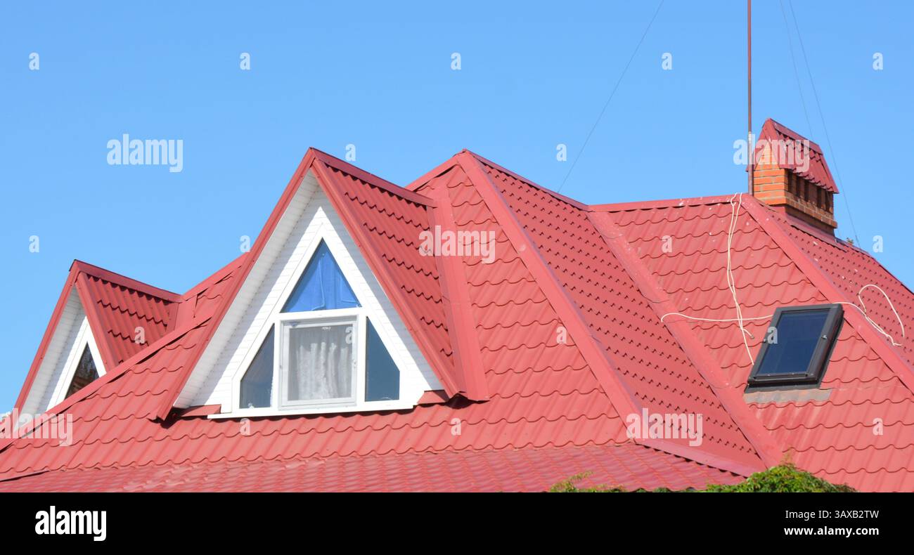 Valley and gable roofing construction with attic windows. A hip and ...