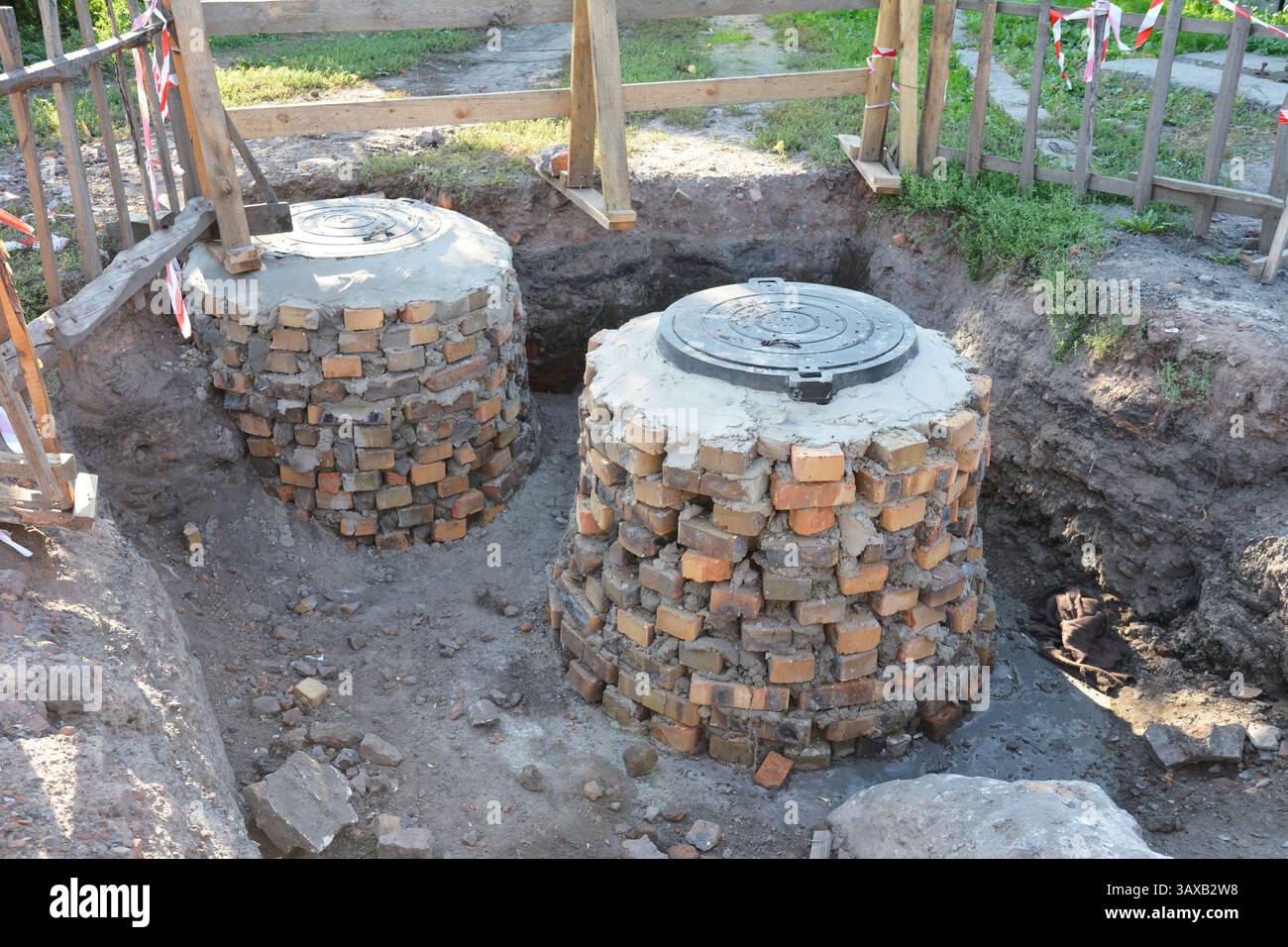 Septic tanks construction from brick. Two septic tanks with plastic ...