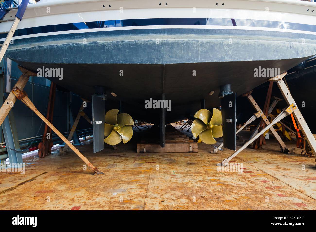 Aft with two propellers of the luxury motor yacht is dry docked on ...