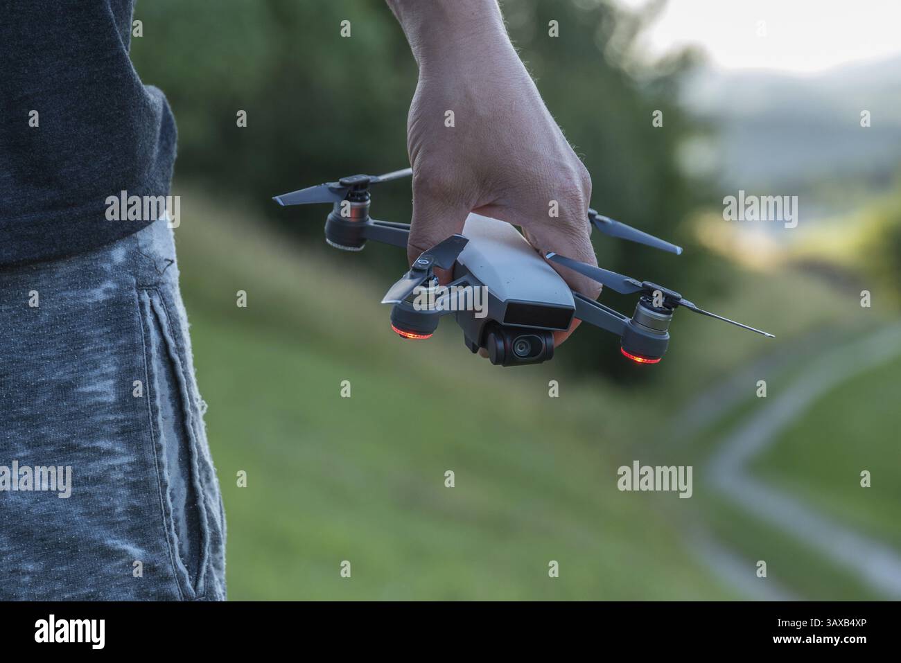 Man with a drone in his hand - detail flying drone Stock Photo - Alamy