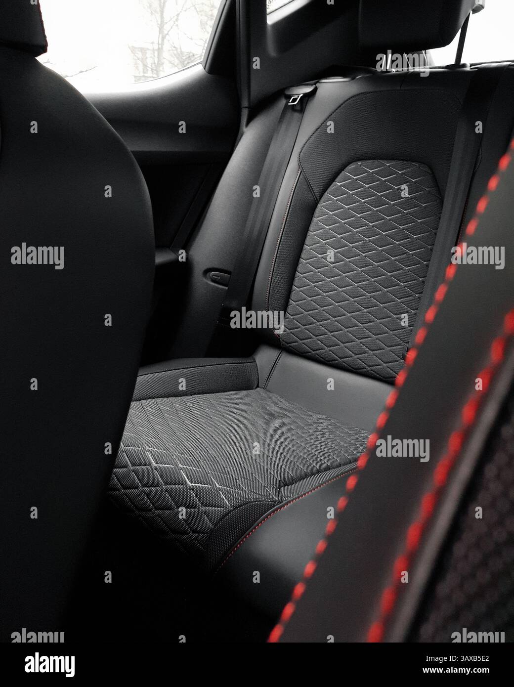 Rear seat in a car - view from front row. Hatchback interior with black ...