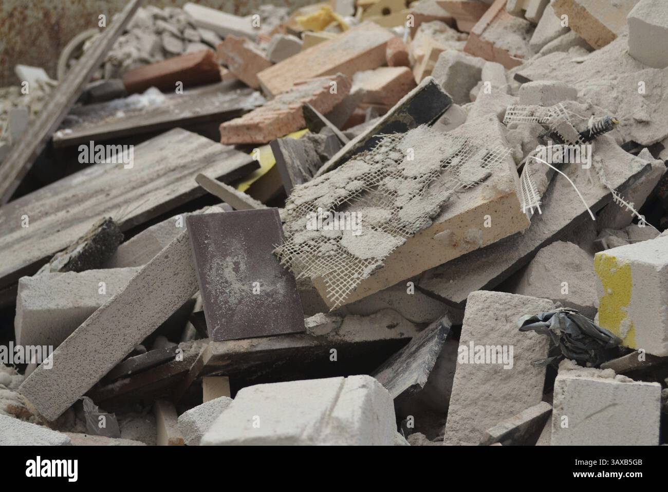 Collected building rubble in a collection container Stock Photo - Alamy