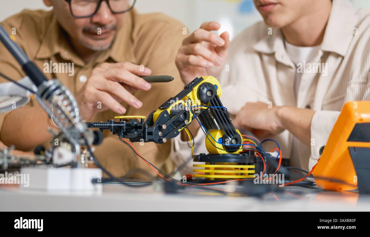 engineering robot technology with asian programmer innovation and research teamwork in coding ...