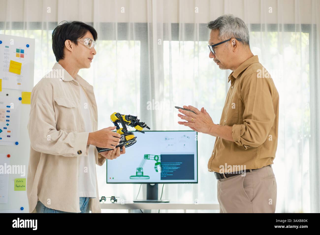 engineering robot technology with asian programmer innovation and research teamwork in coding ...