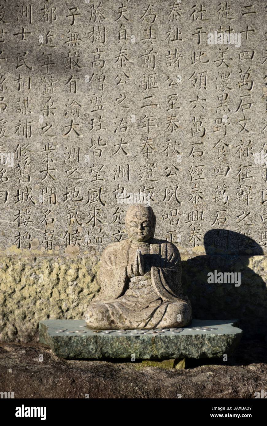 Photo shows a buddhist statue in the grounds of Ozu Castle in Ozu City ...