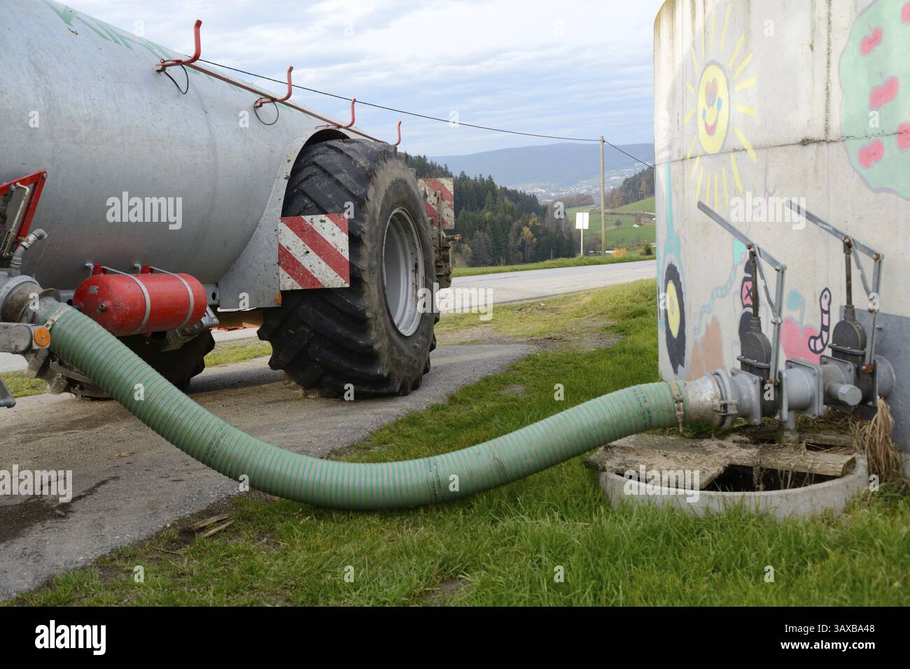 Slurry is filled into slurry barrels Stock Photo - Alamy