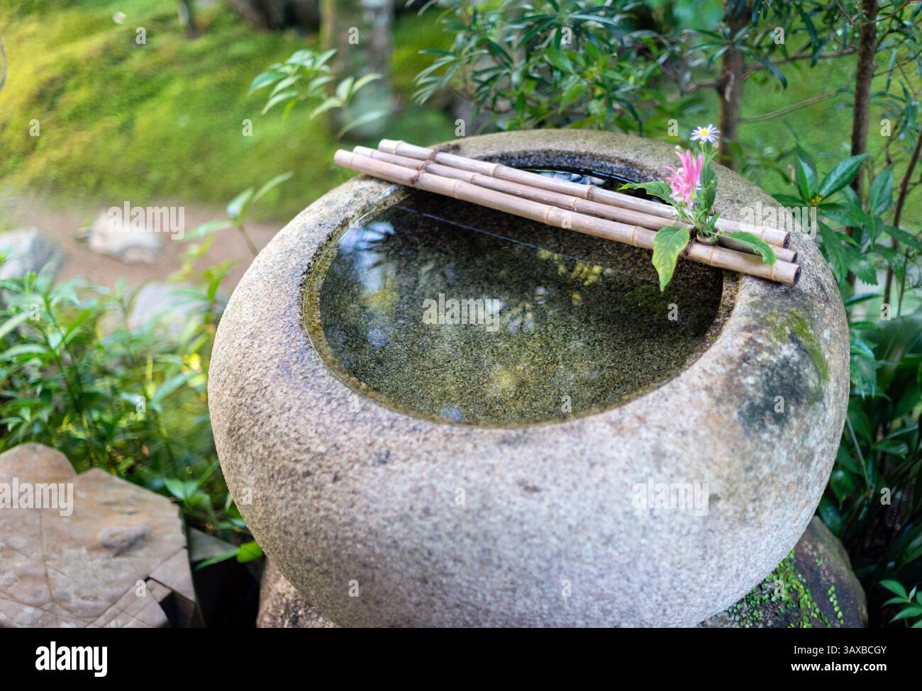 Photo shows one of the wells in the garden at Garyu Sanso villa in Ozu ...