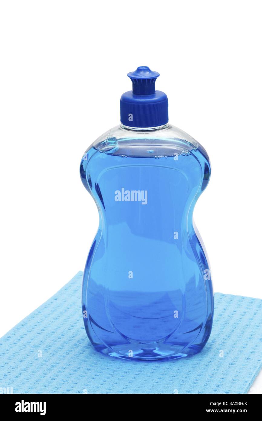Dishwashing detergent with dishwashing cloth over white background ...