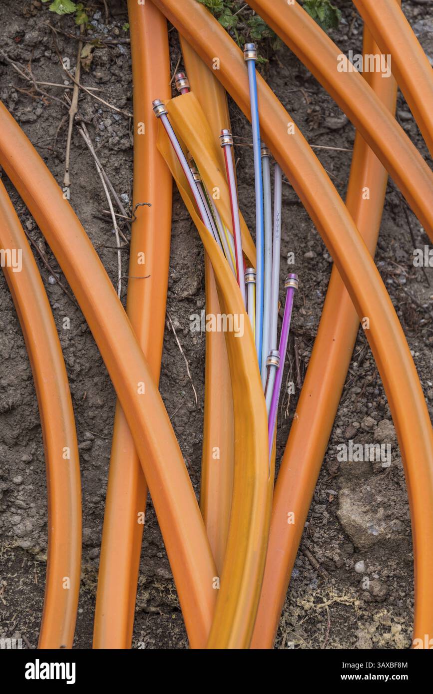 Fast internet and communication via fibre optic cable - close-up ...