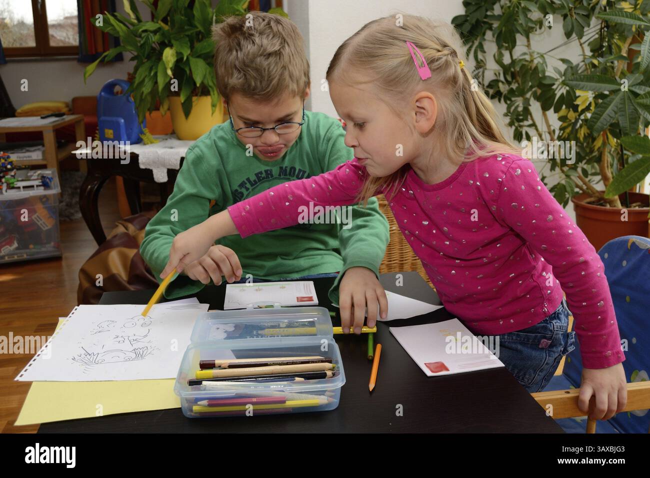 Two siblings draw Stock Photo - Alamy