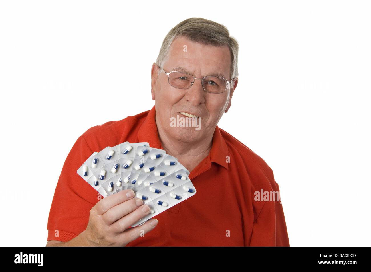 Old man holding blister packs in his hand - isolated Old man holding ...