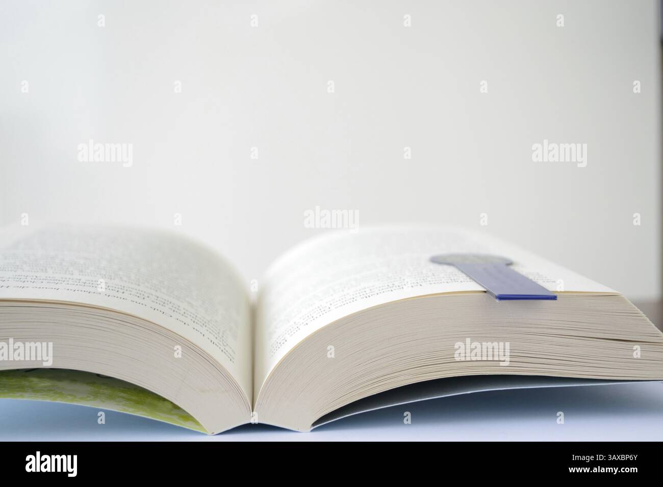 Open book with a bookmark and text space Stock Photo - Alamy