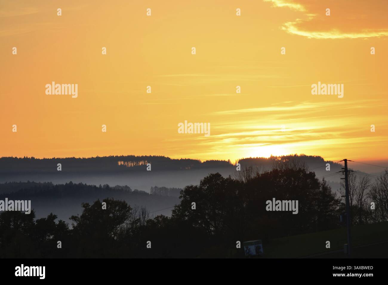 Landscape with sea of fog and romantic sunset Stock Photo - Alamy