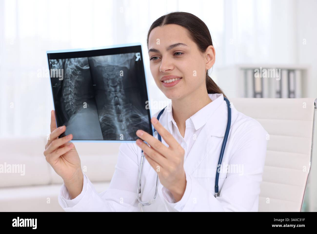 Doctor examining neck MRI scan in hospital Stock Photo - Alamy