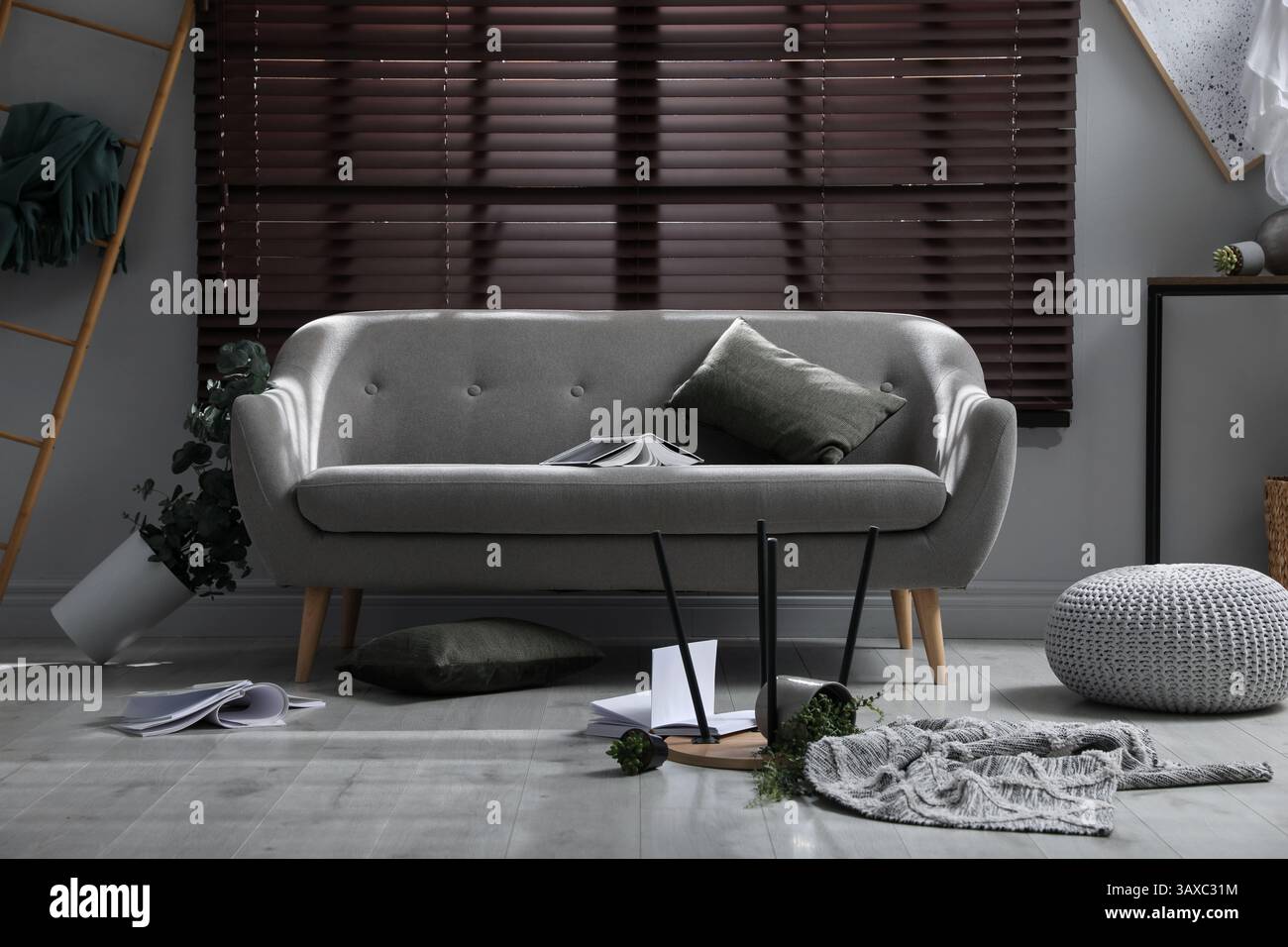 Chaotic living room interior after strong earthquake Stock Photo - Alamy