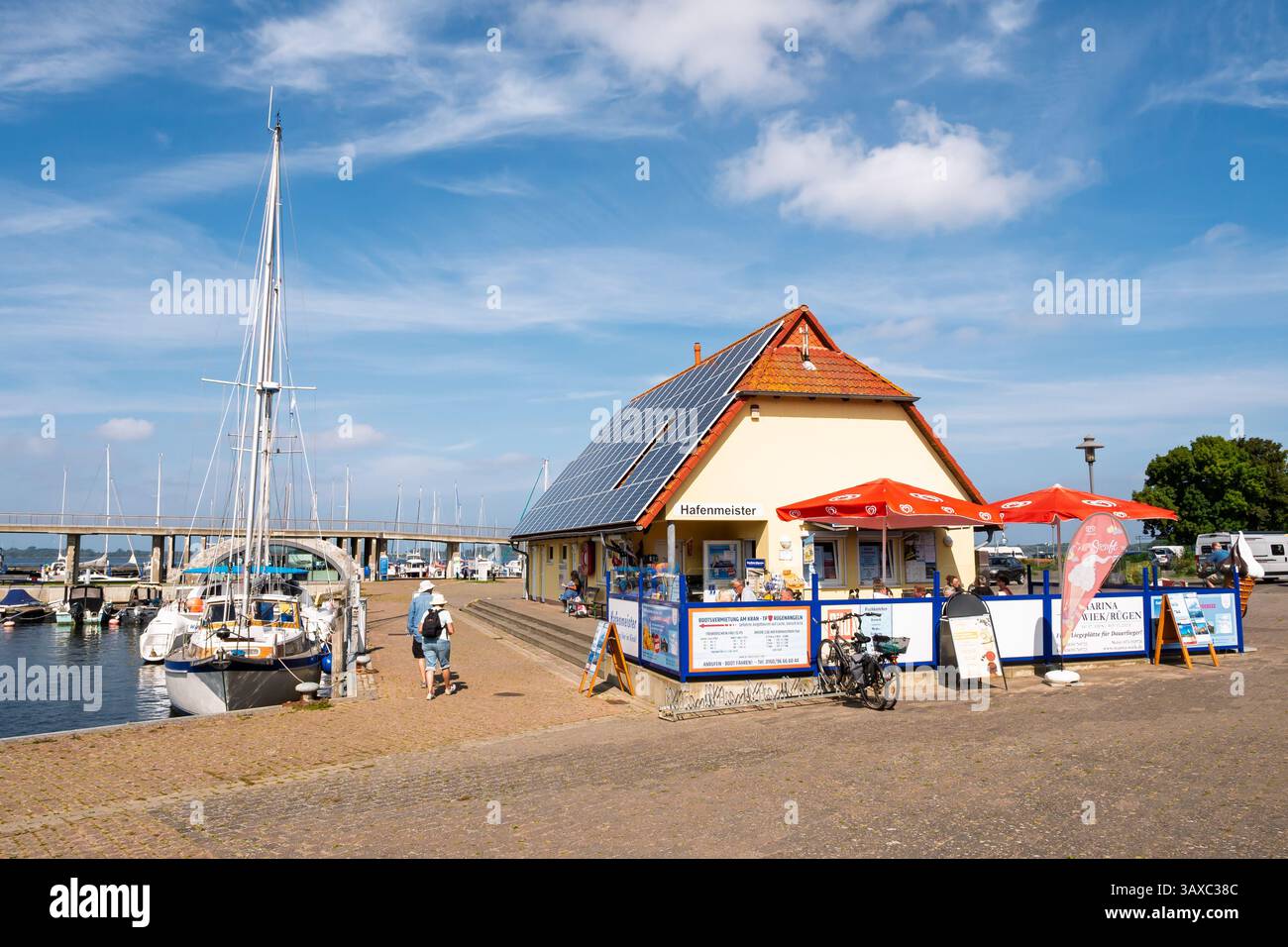 Cafe with outdoor seating and people enjoying drinks and snacks at Wiek ...