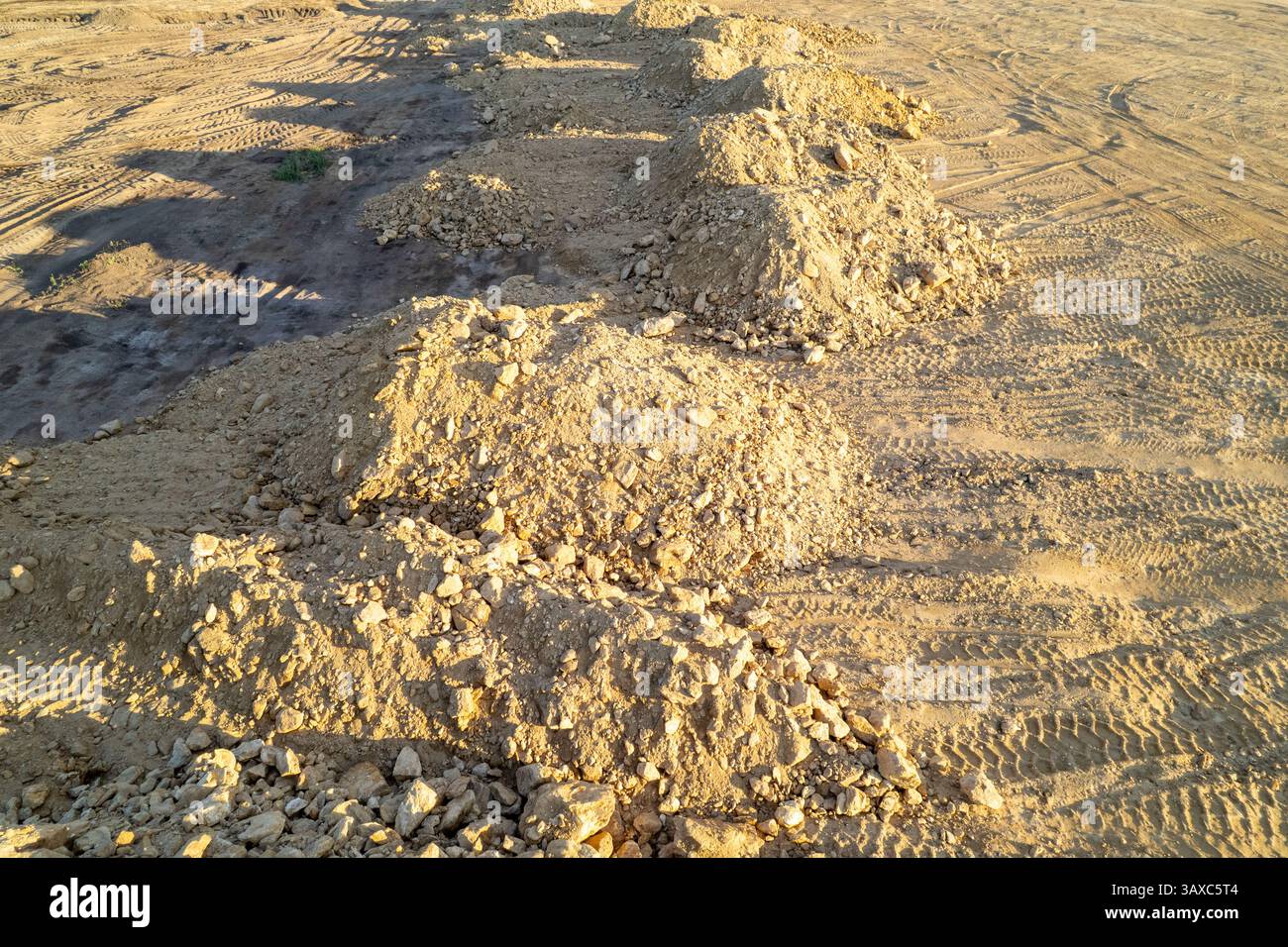 abstract pattern of earth and rock mounds, piles of dirt and rocks on ...