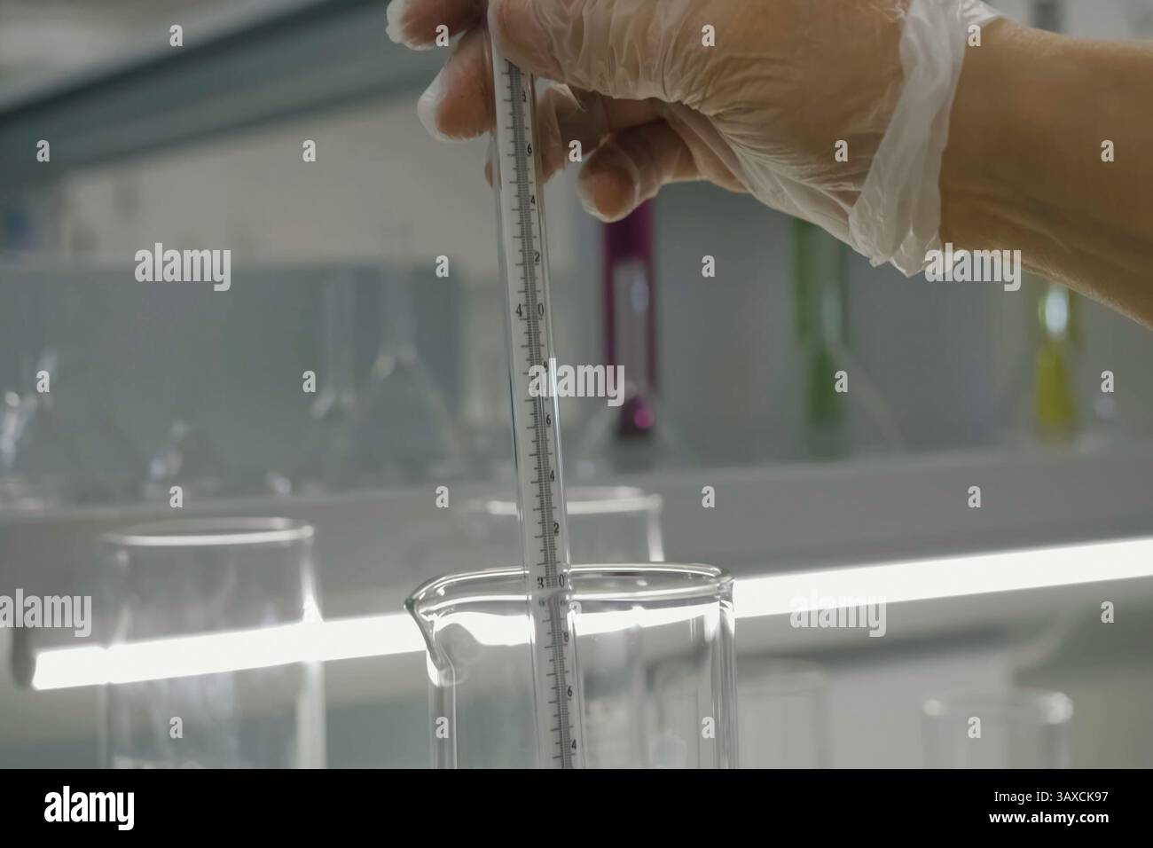 Thermometer in a glass beaker. Laboratory tests Stock Photo - Alamy