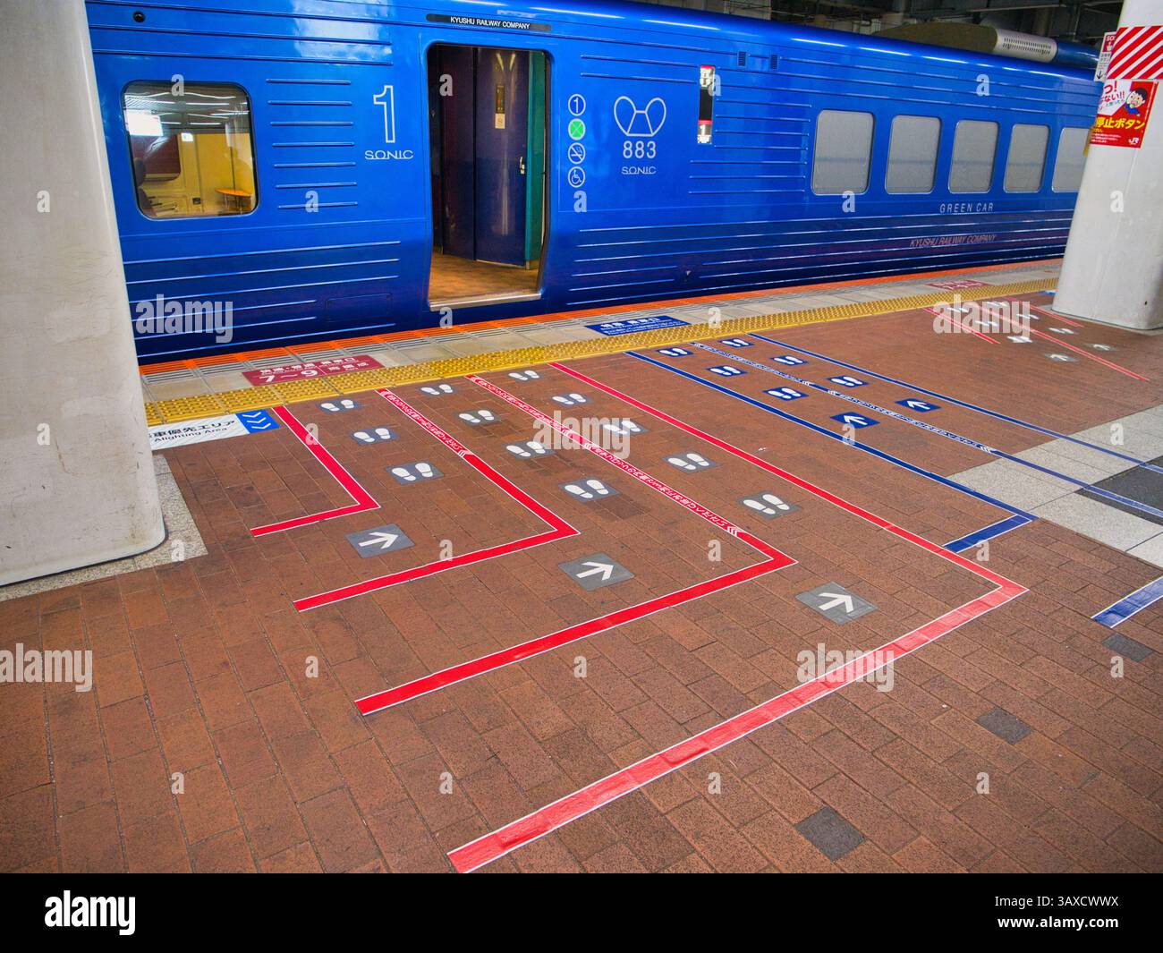 Train platform markings on Kyushu, Japan, indicating passenger queue ...