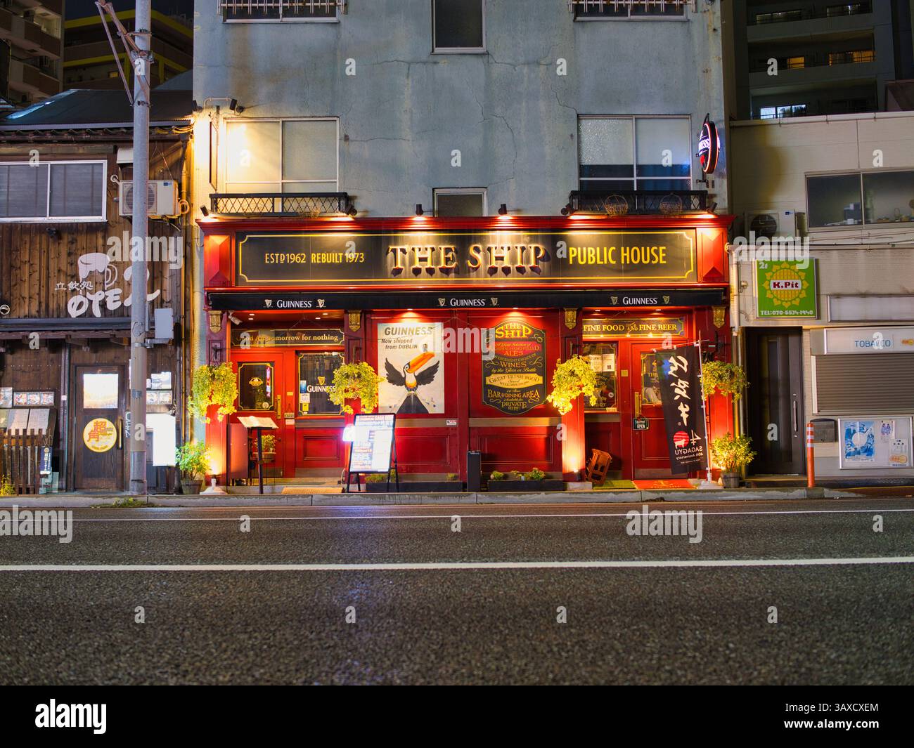 European-style pub "The Ship" illuminated at night in Fukuoka, Japan. A ...
