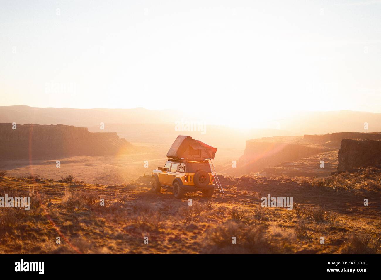Overland truck with rooftop tent in glowing sunrise, Washington Stock ...