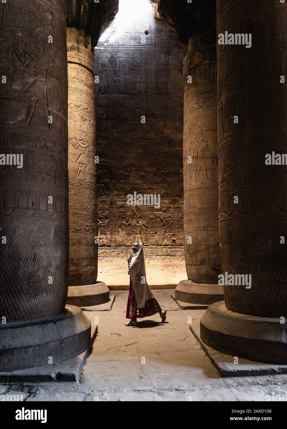 woman exploring the temple of Horus close to the river Nile / Egypt ...