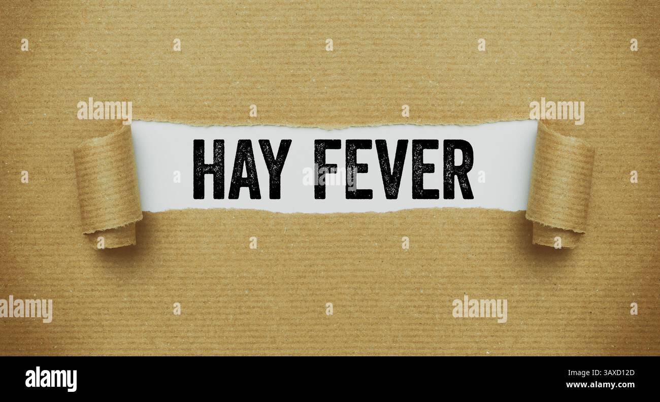Torn paper revealing the word Hay fever Stock Photo - Alamy