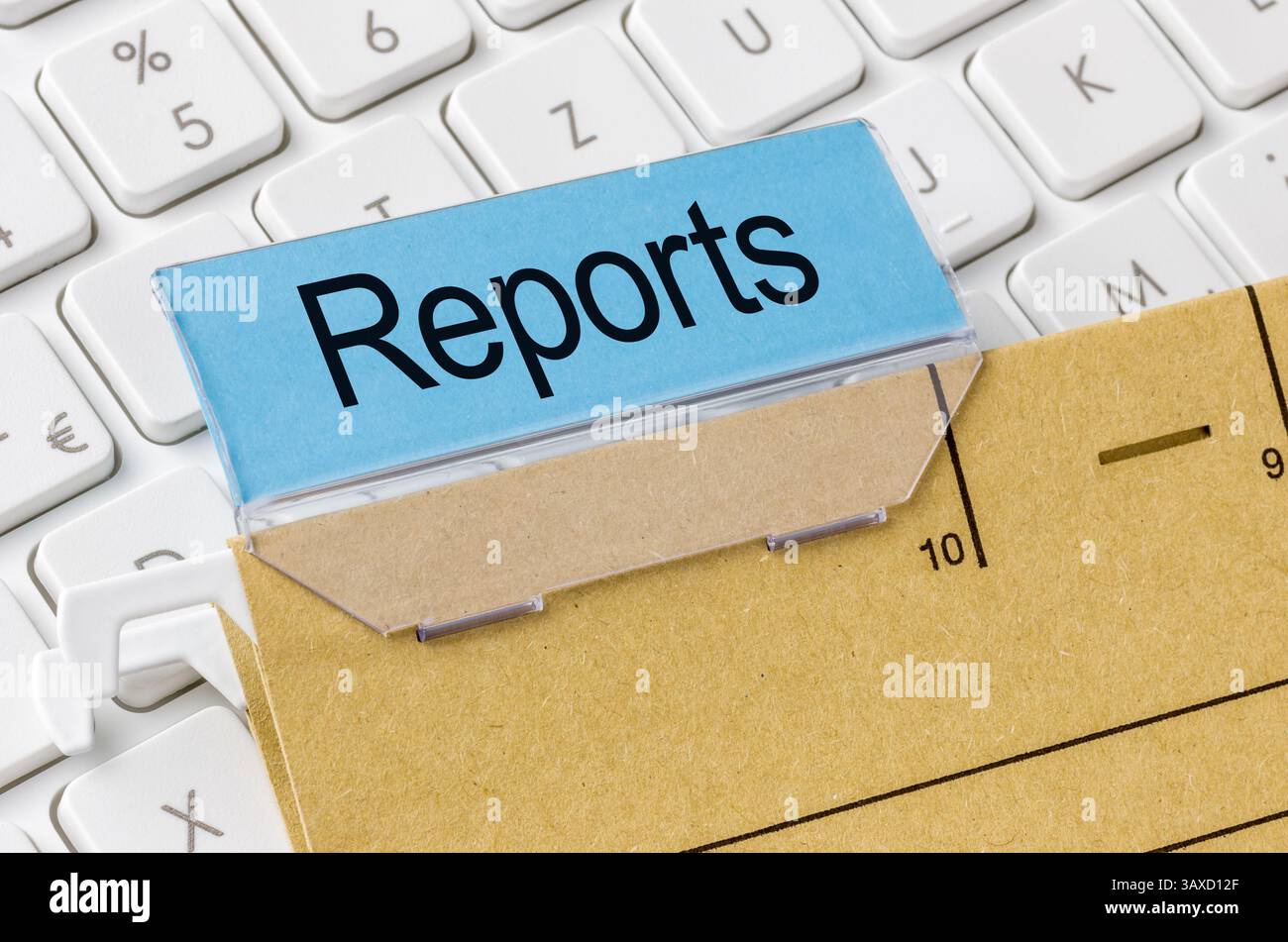 A brown file folder labeled with Reports Stock Photo - Alamy