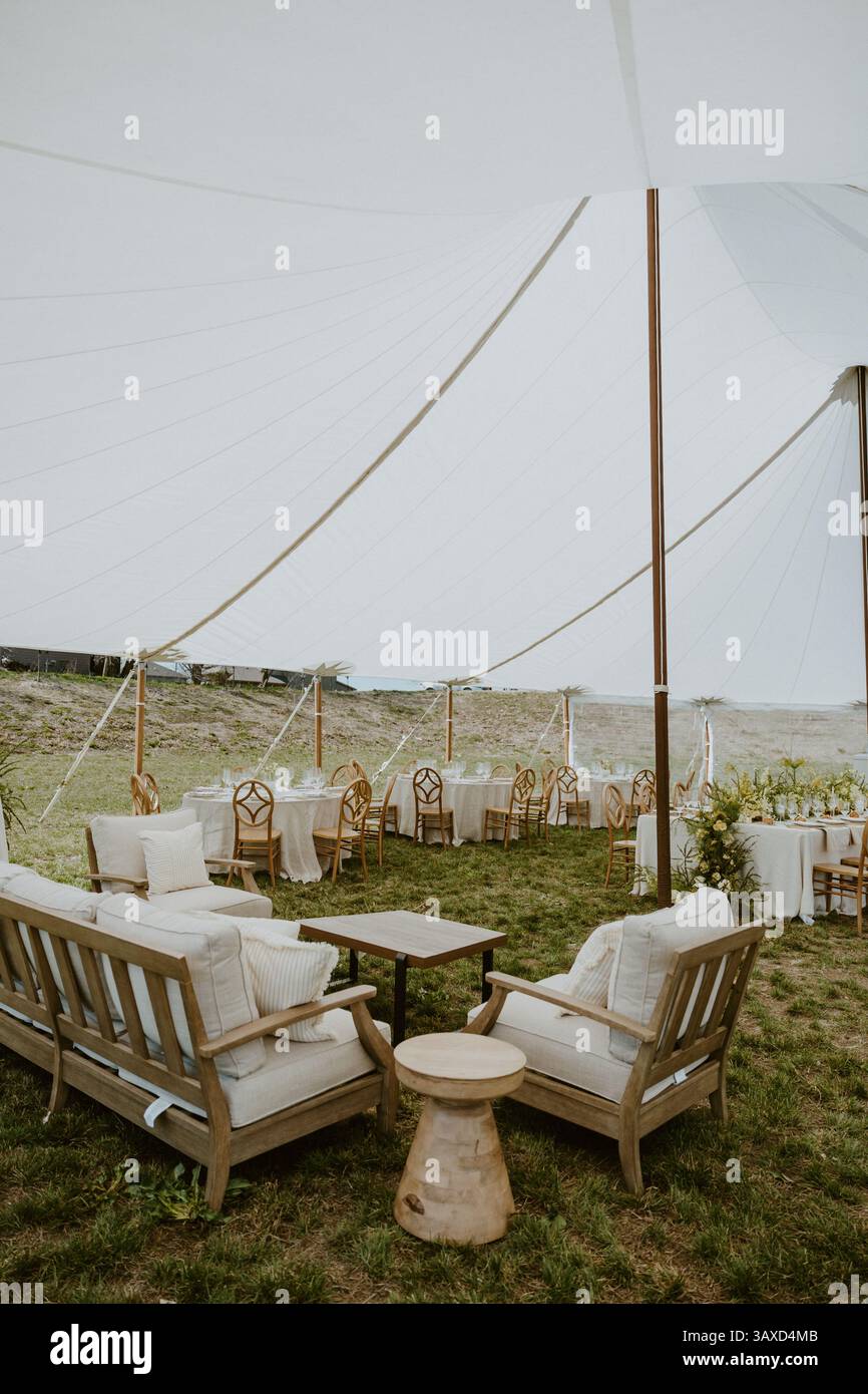 Lounge Seating Area with Accent Table in Outdoor Wedding Tent Stock ...