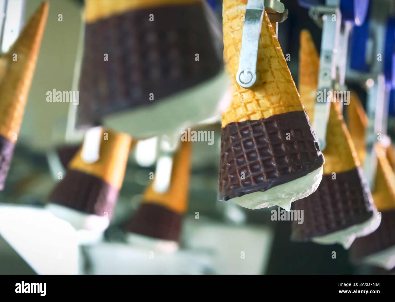 Ice cream cones on a conveyor. Ice cream factory Stock Photo - Alamy