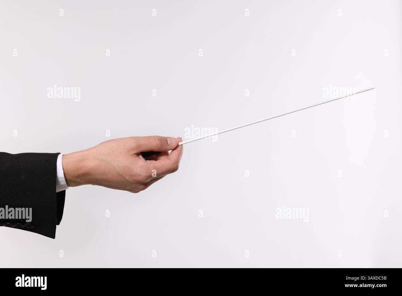 Conductor with baton on light grey background, closeup Stock Photo - Alamy