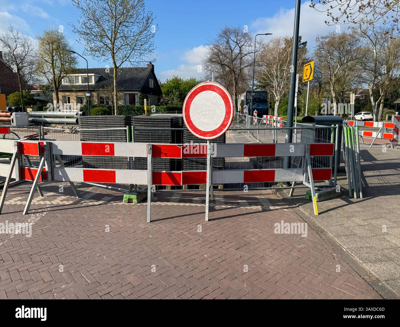 Road sign and barricade on city street Stock Photo - Alamy