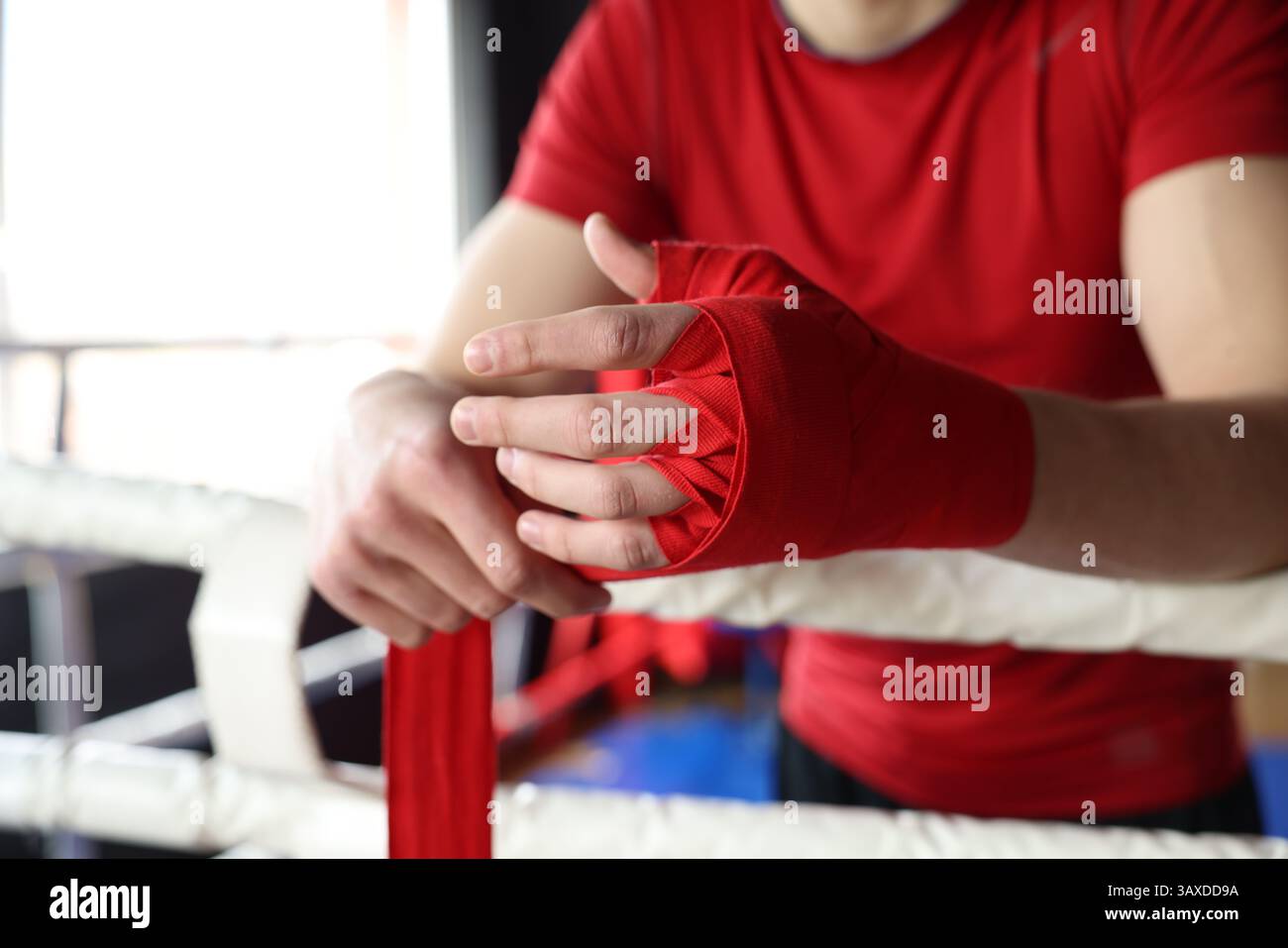 Man wrapping her hands on boxing ring, closeup Stock Photo - Alamy