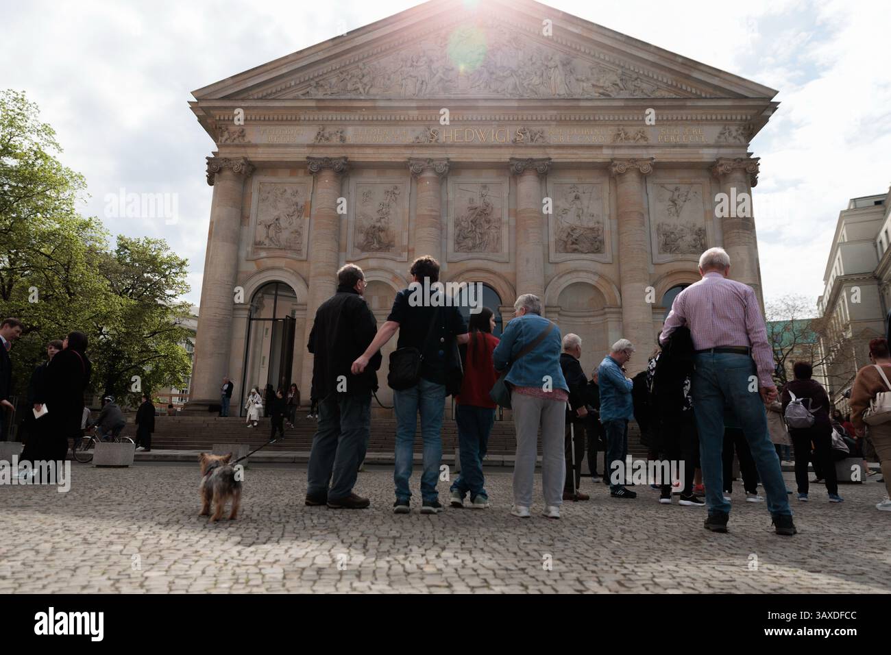Berlin, Germany. 21st Apr, 2025. People stand in front of St. Hedwig's ...