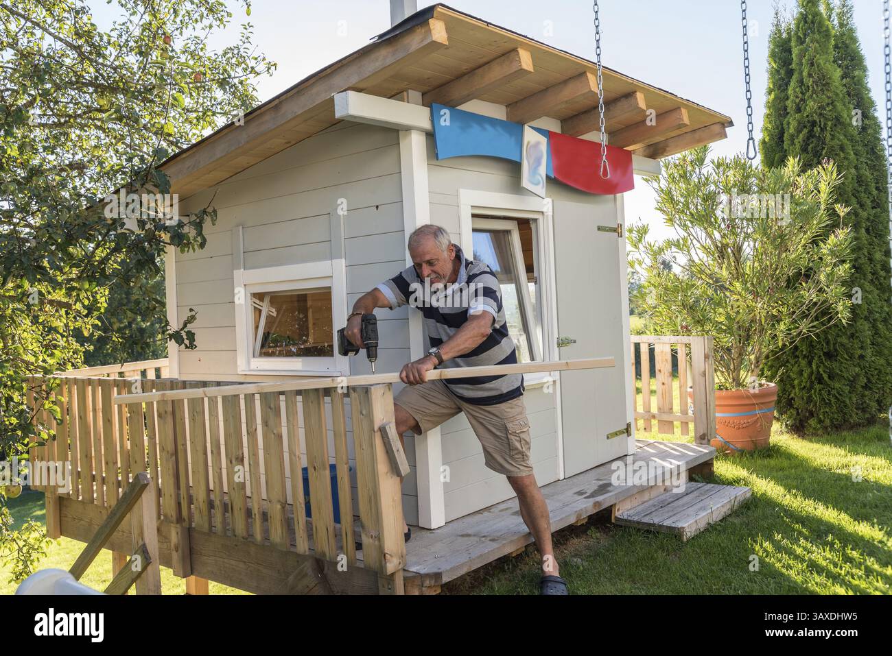 DIY enthusiast builds his own sturdy wooden hut in the garden Stock ...