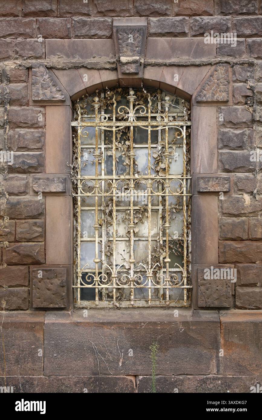Barred basement window Stock Photo - Alamy