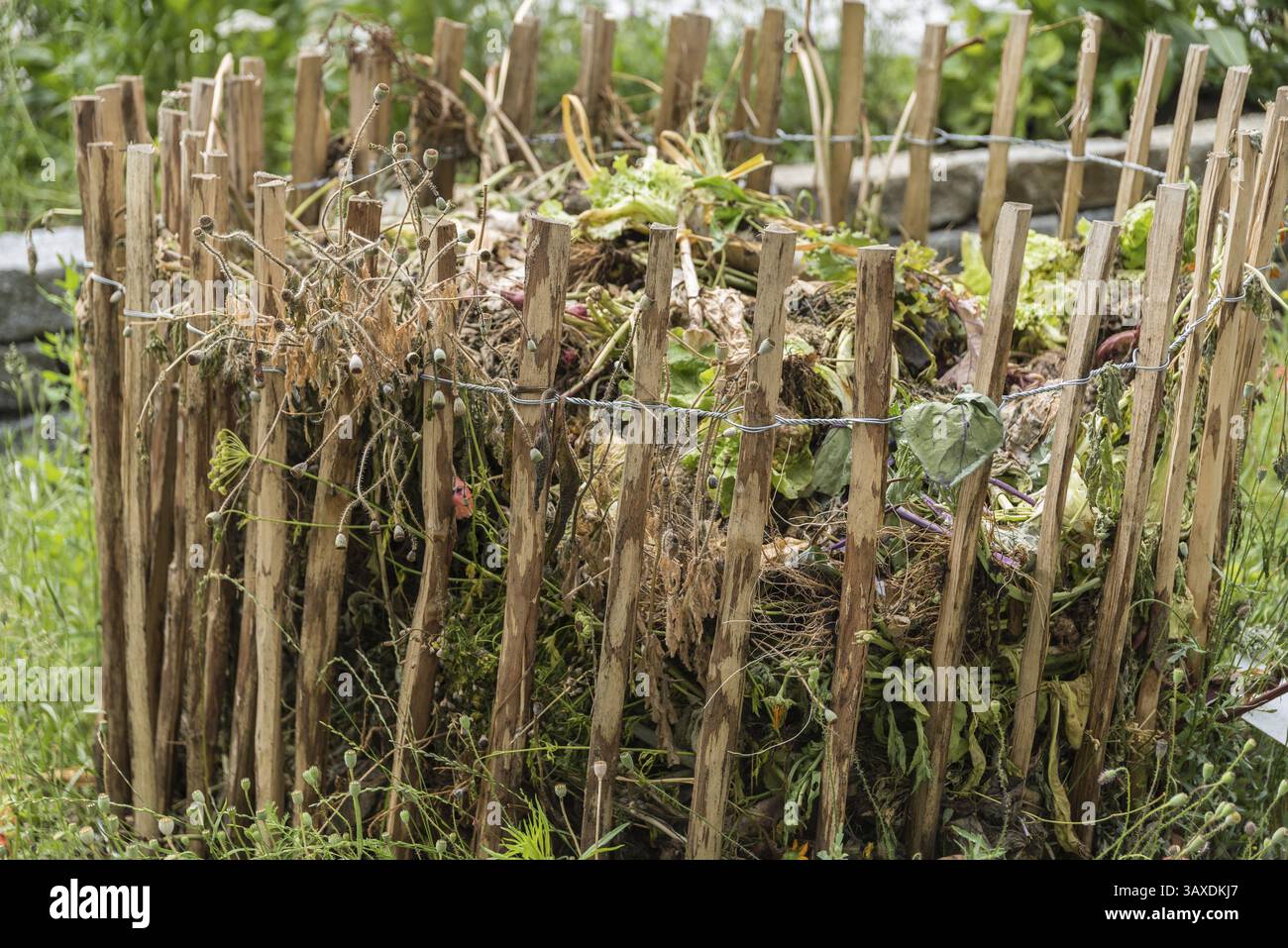 Original composter in the garden made of wood - compost heap Stock ...