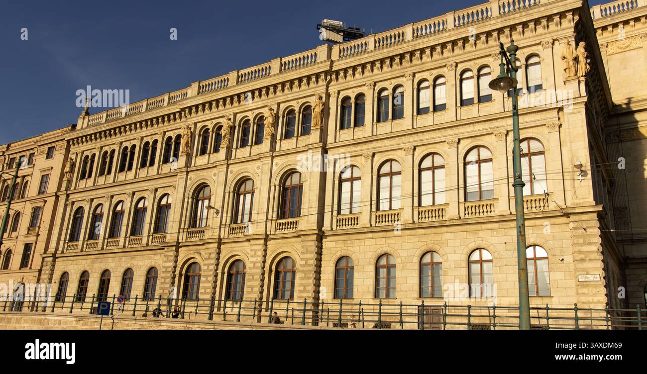 Facade of historic neoclassical building with arched windows and ...