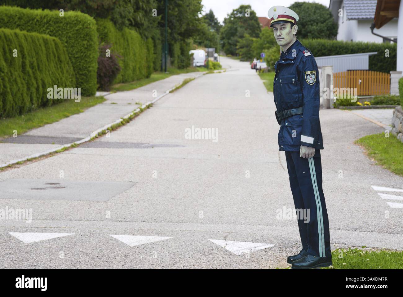 Traffic policeman at road crossing and school route for the purpose of ...
