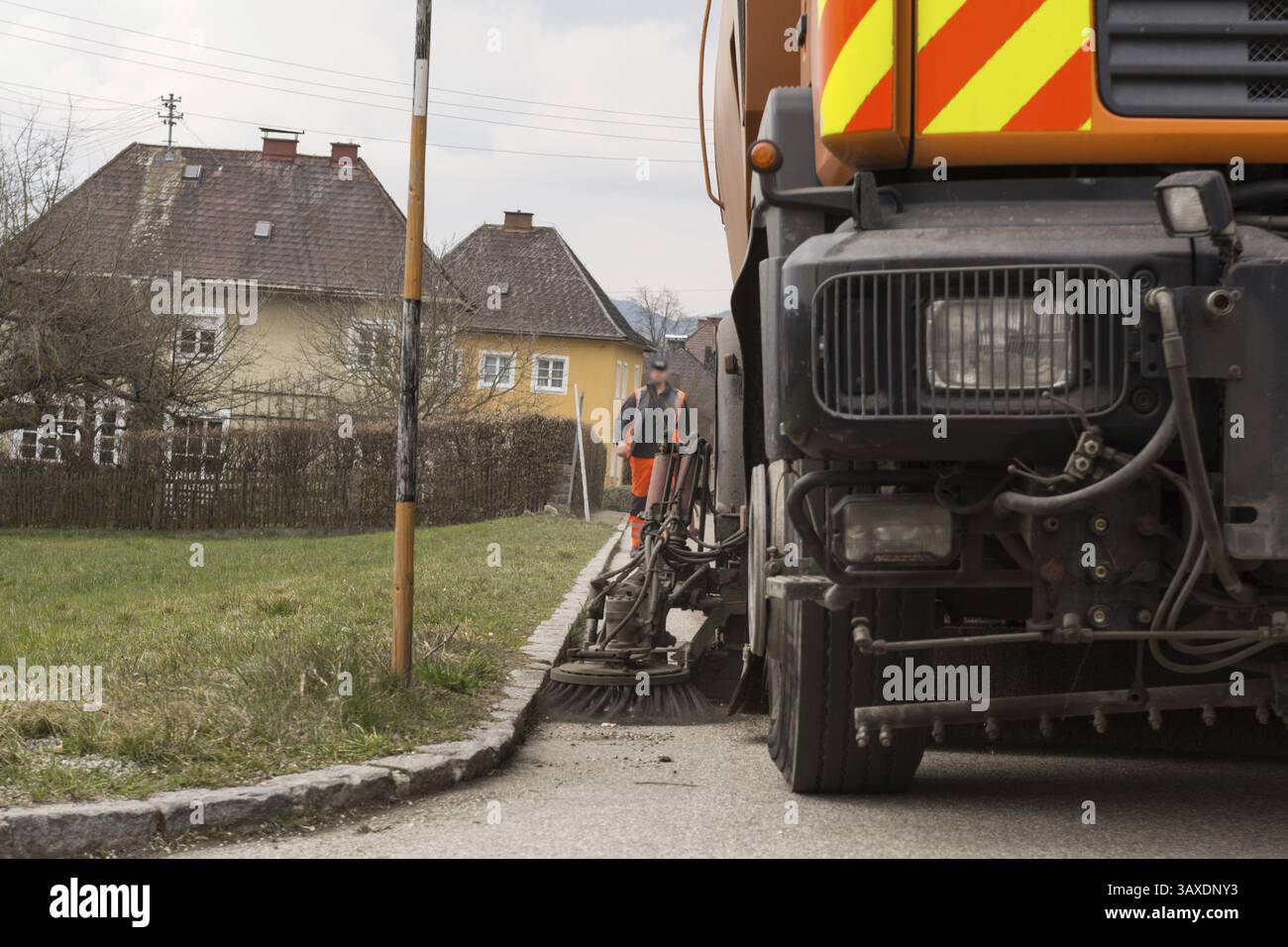 Road sweeper during spring cleaning - roadside is cleaned Stock Photo ...