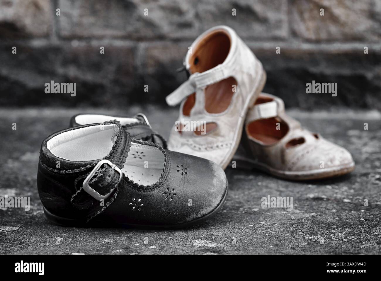 Two pairs of children's shoes Stock Photo - Alamy