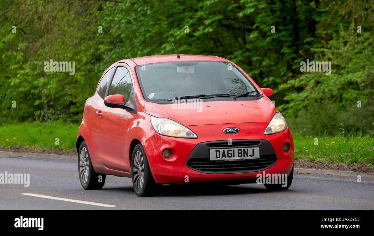 Milton Keynes,UK - Apr. 9th 2025: 2011 red Ford Ka car driving on a ...