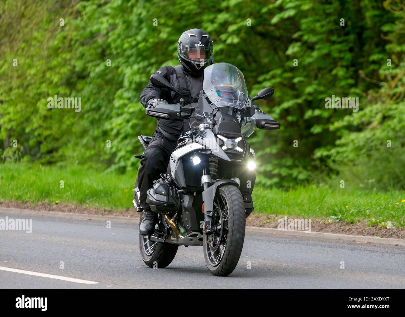 Milton Keynes,UK - Apr. 9th 2025: Man riding a BMW. motorcycle on a ...