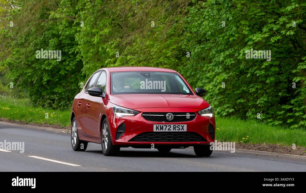 Milton Keynes,UK - Apr. 9th 2025: 2022 red Vauxhall Corsa car driving ...